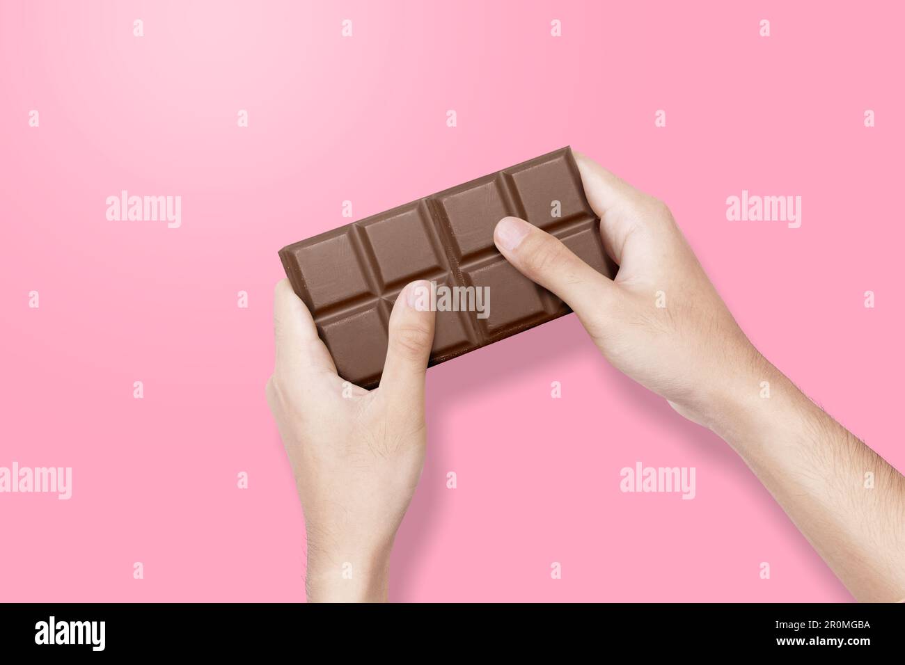 Human hand holding the chocolate bar. World chocolate day concept Stock ...