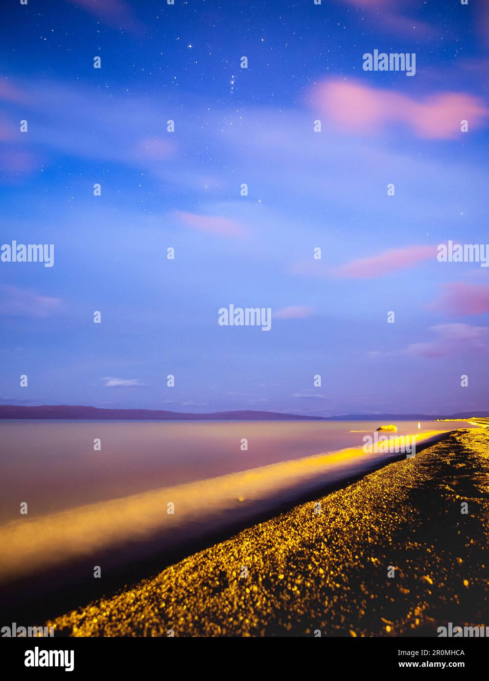 A breathtaking sunrise over the horizon, its beauty highlighted by a ...