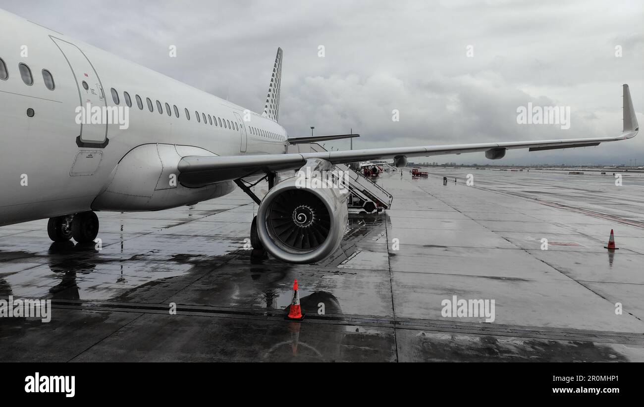 A large commercial jet aircraft on the runway of an airport tarmac ...