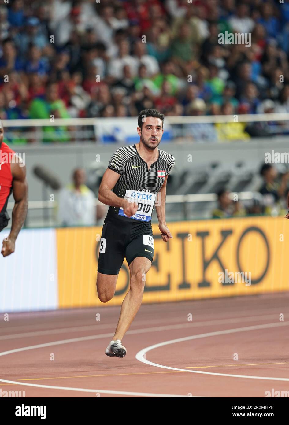 Noureddine Hadid running the 200m at the 2019 World Athletics Championships in Doha Stock Photo ...
