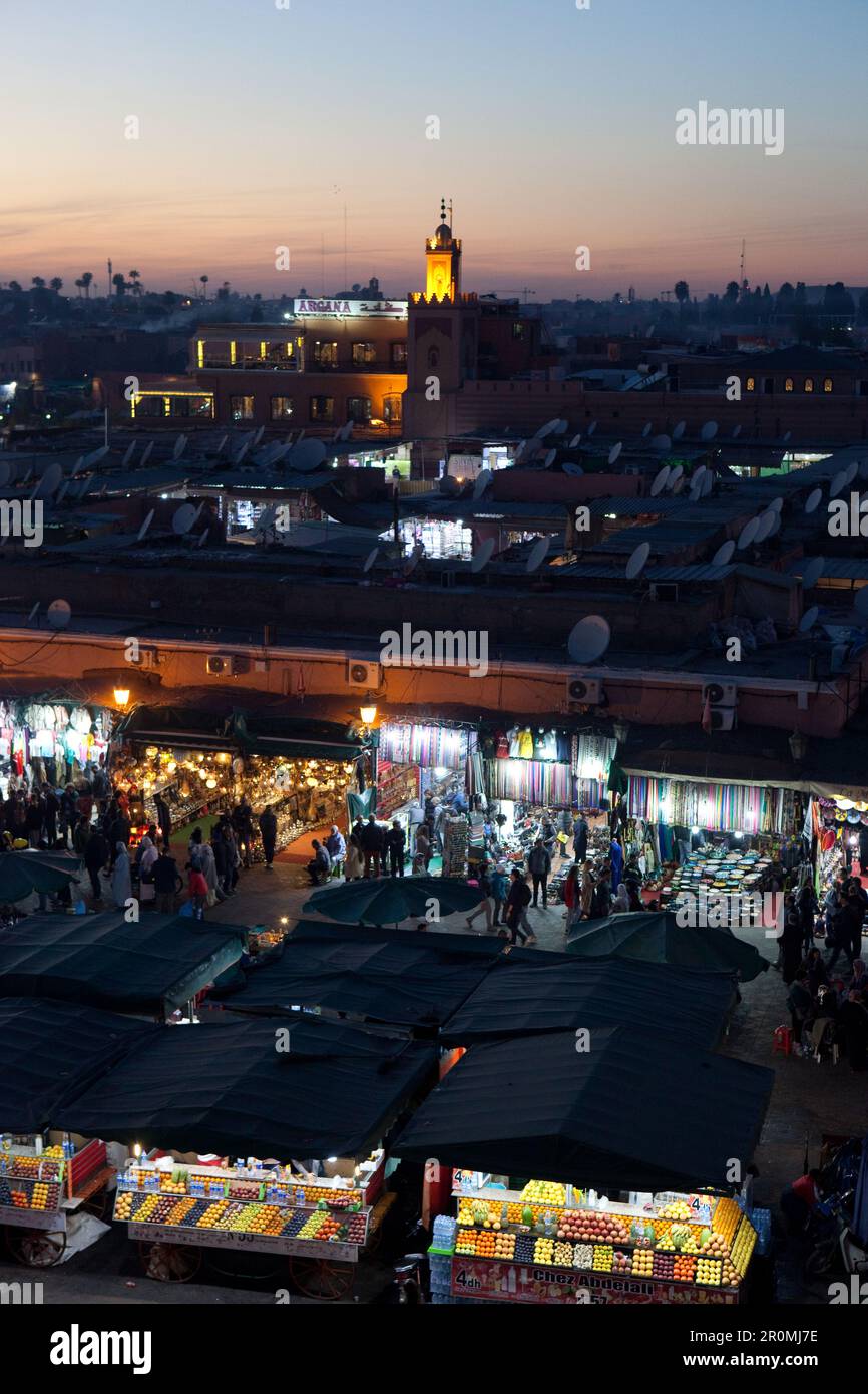 View from a rooftop bar at night over the main square Djemaa el-Fna and ...