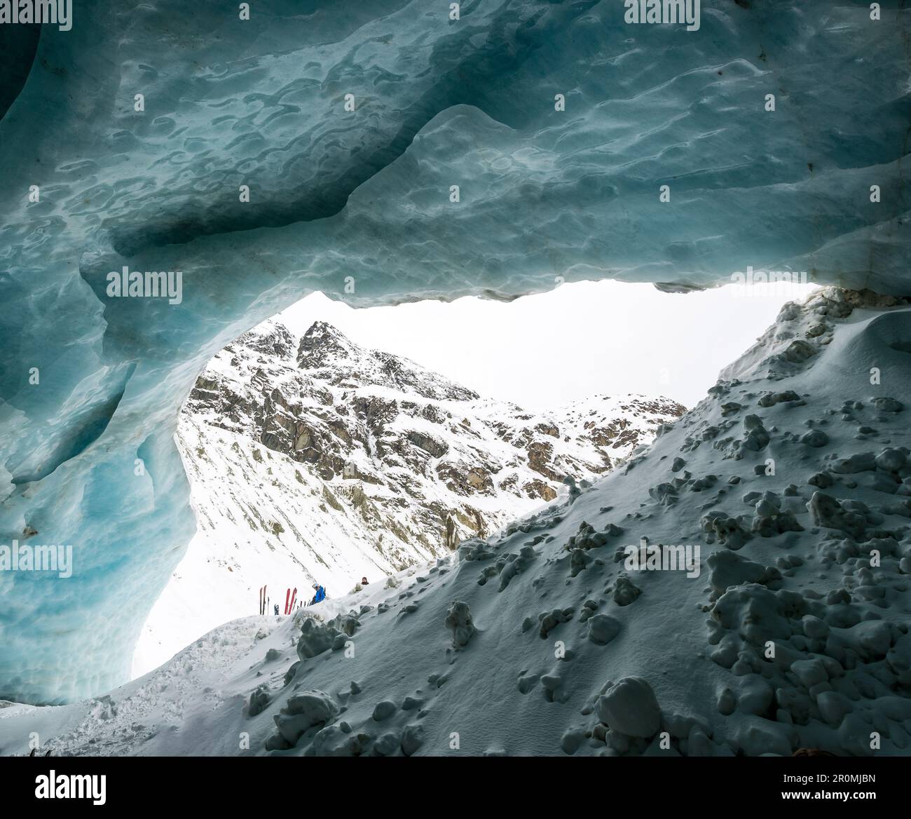 entrance to an deep blue ice ice cave in the Valais Alps Stock Photo ...
