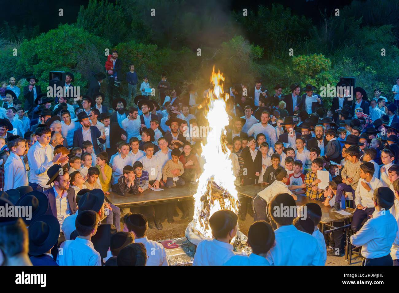 Haifa, Israel - May 08, 2023: Ultra-Orthodox Jews gather around a fire ...