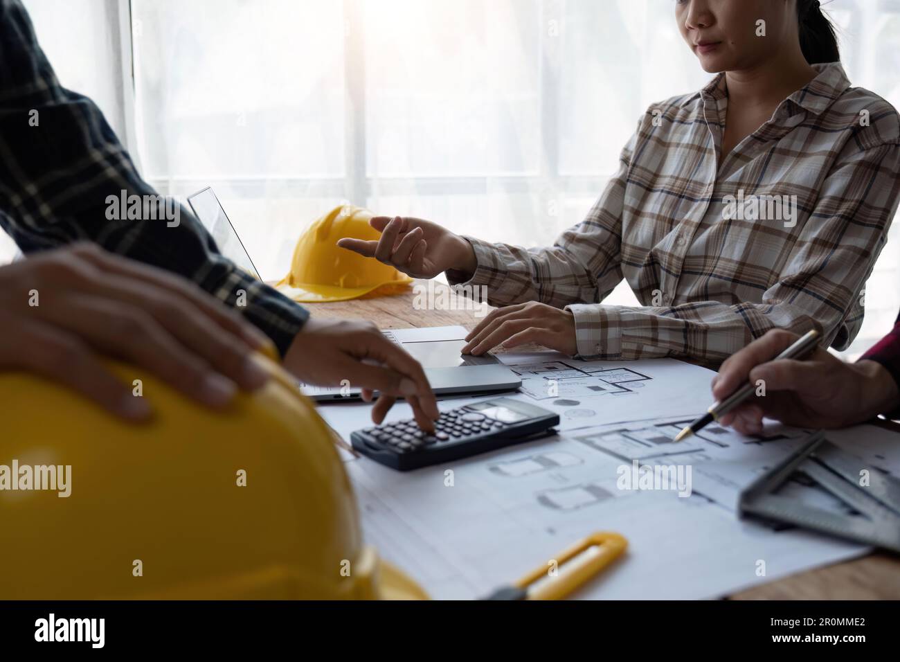 engineer team working in office with blueprints, inspection in ...
