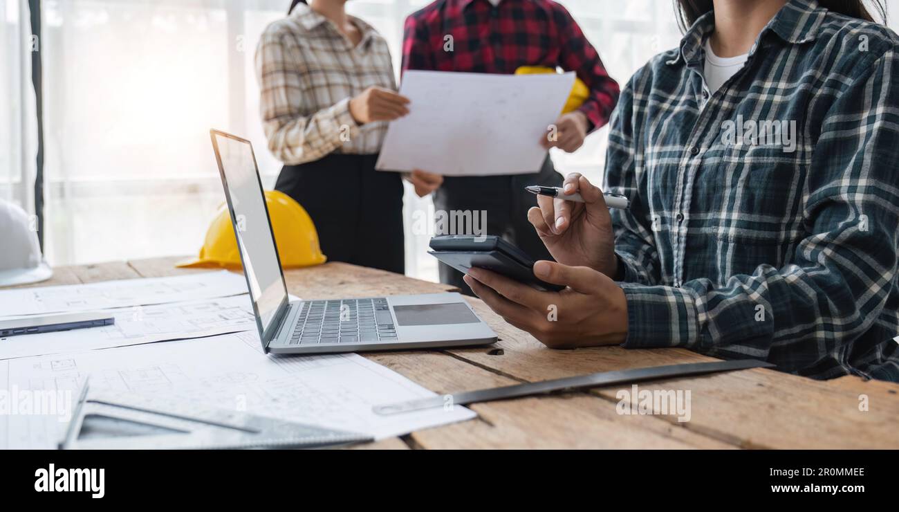 engineer working in office, engineer and architect use calculator for ...