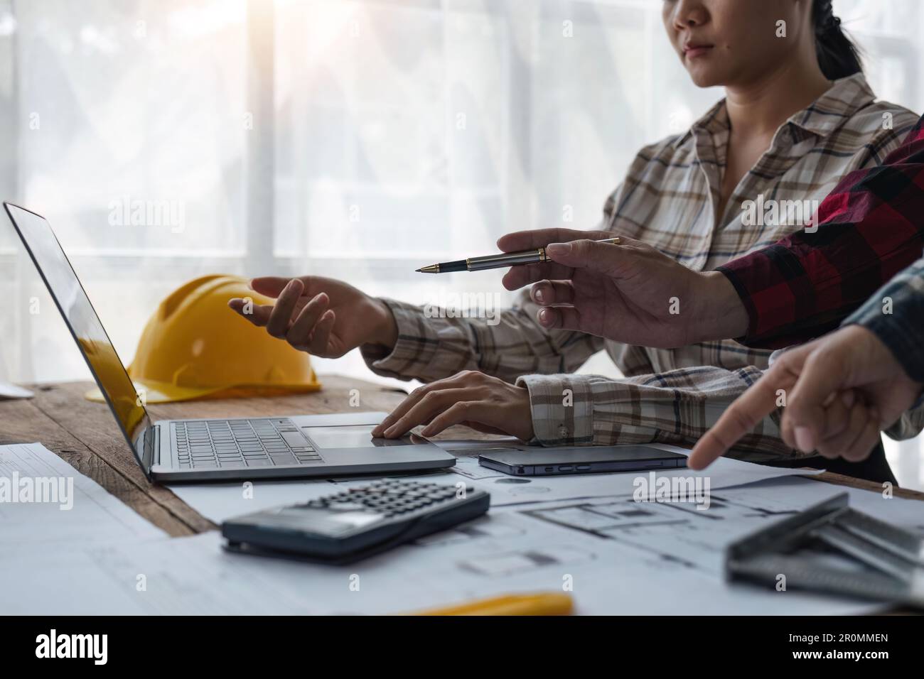 engineer team working in office with blueprints, inspection in ...