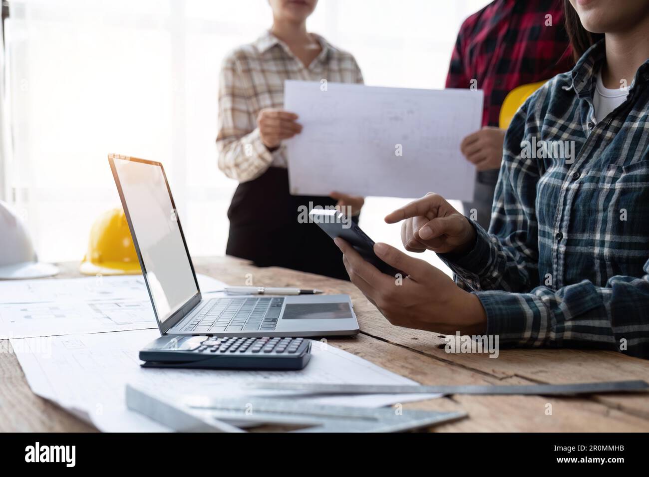 engineer working in office, engineer and architect use calculator for ...