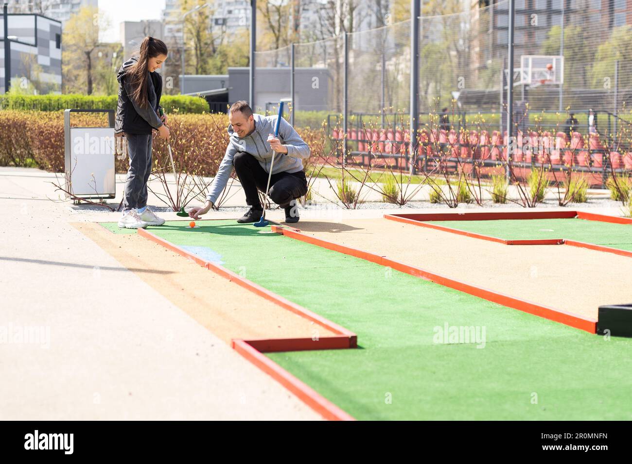 Mini-golf ball on artificial grass. Summer season game Stock Photo - Alamy