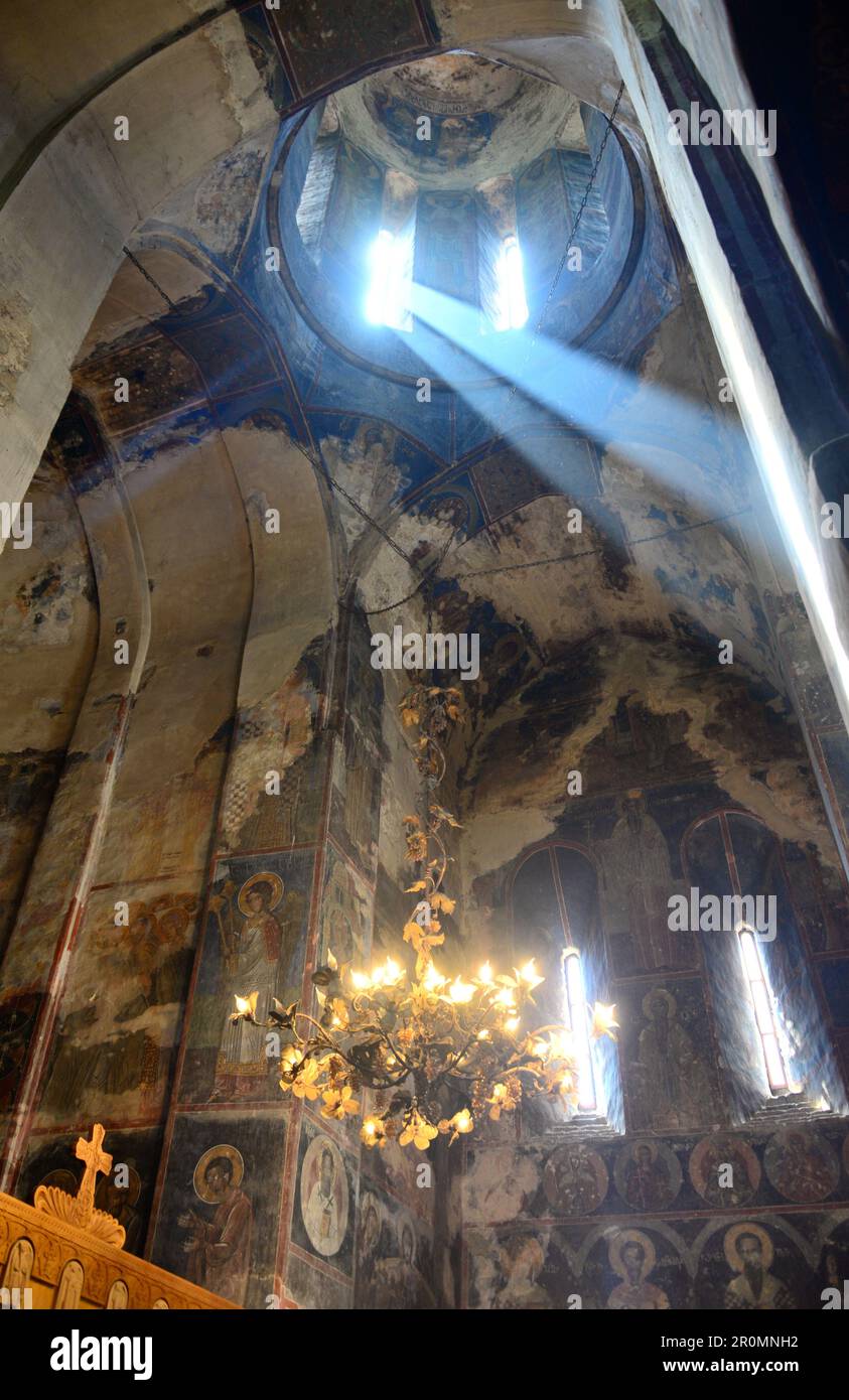 in the prayer room with rays of light and frescoes, the monastery of ...