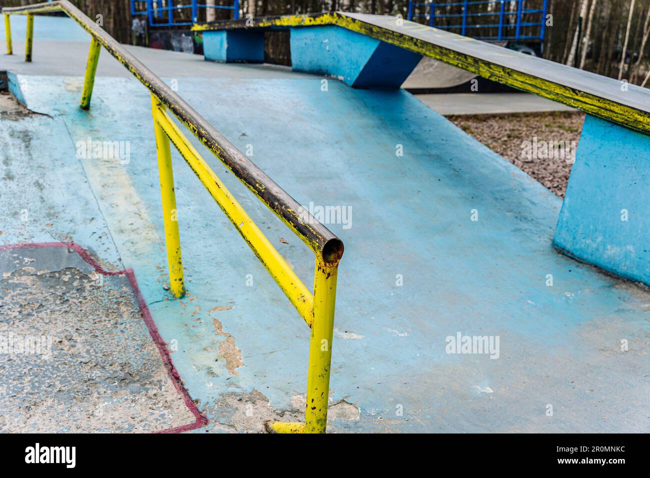 a ramp with an iron ramp for jumping in a skate park Stock Photo - Alamy
