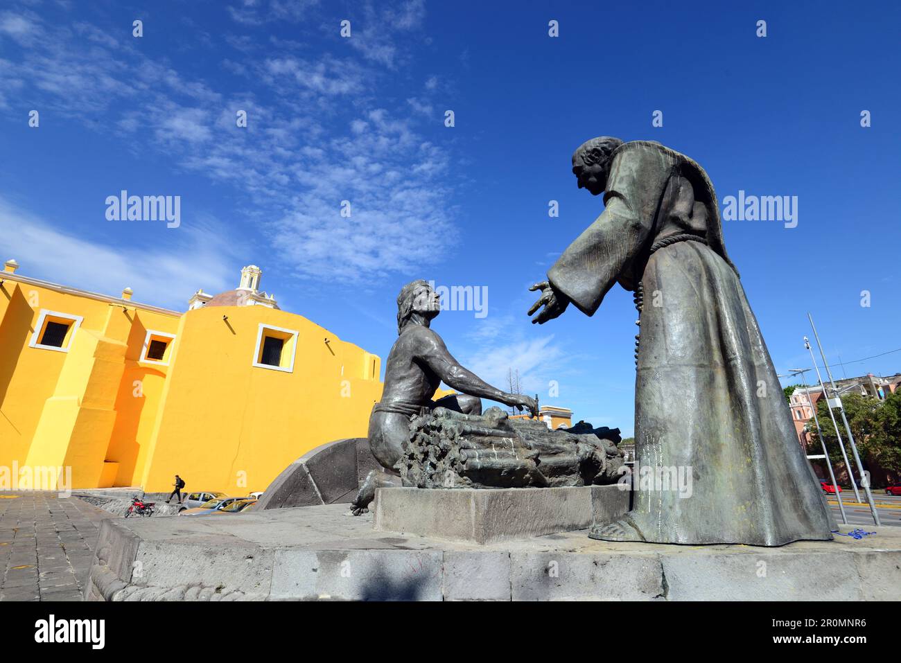 Figure of a Franciscan monk with a peasant in front of San Francisco in ...