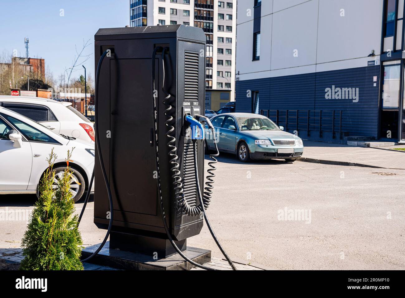 Electric vehicle Charging station . plug-in power cable Stock Photo - Alamy