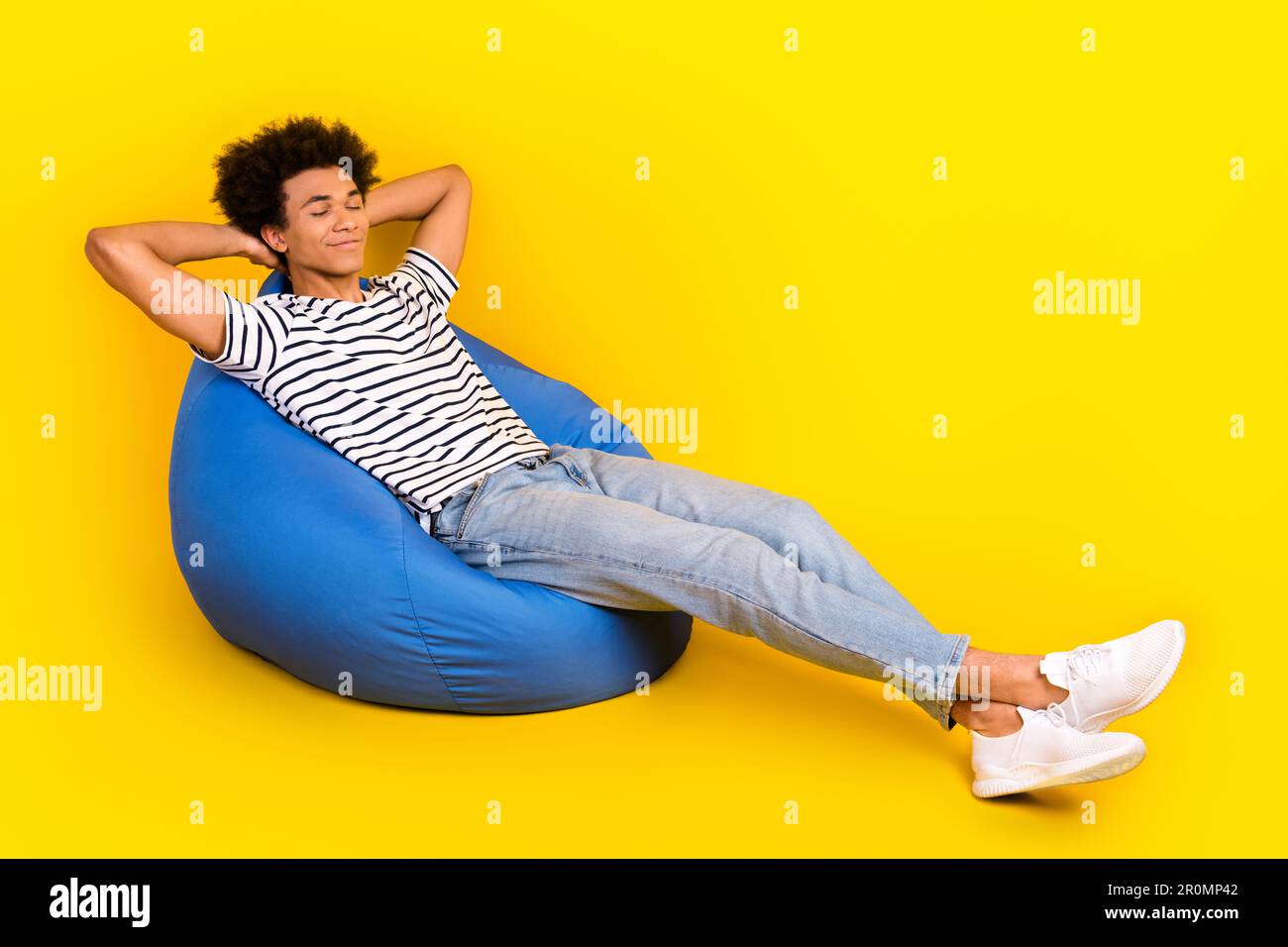 Full body size photo of relaxed young man lying dormitory take nap ...