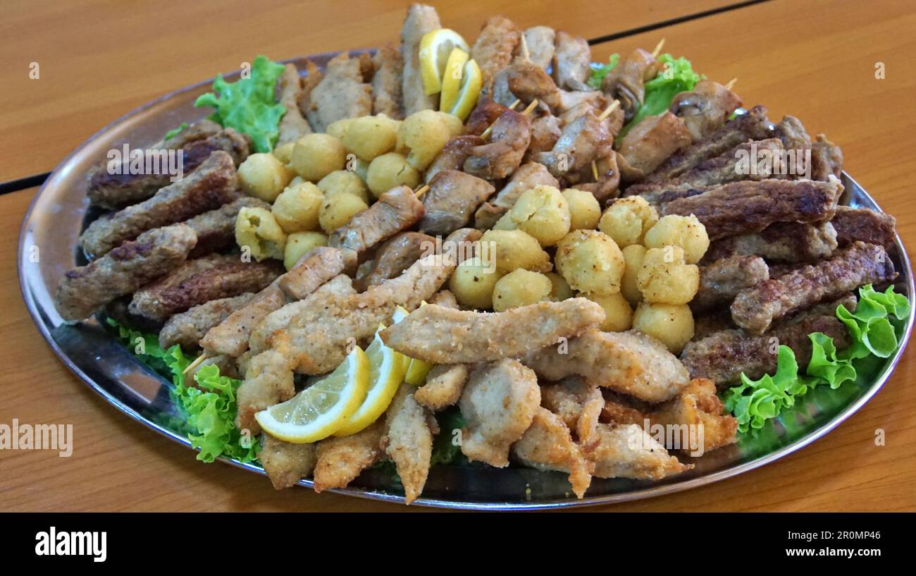 Plate of mixed meats catering food concept Stock Photo - Alamy
