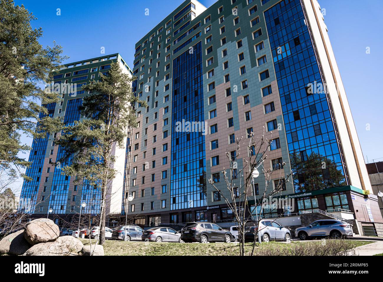 a tall high-rise building finished with glass Stock Photo - Alamy