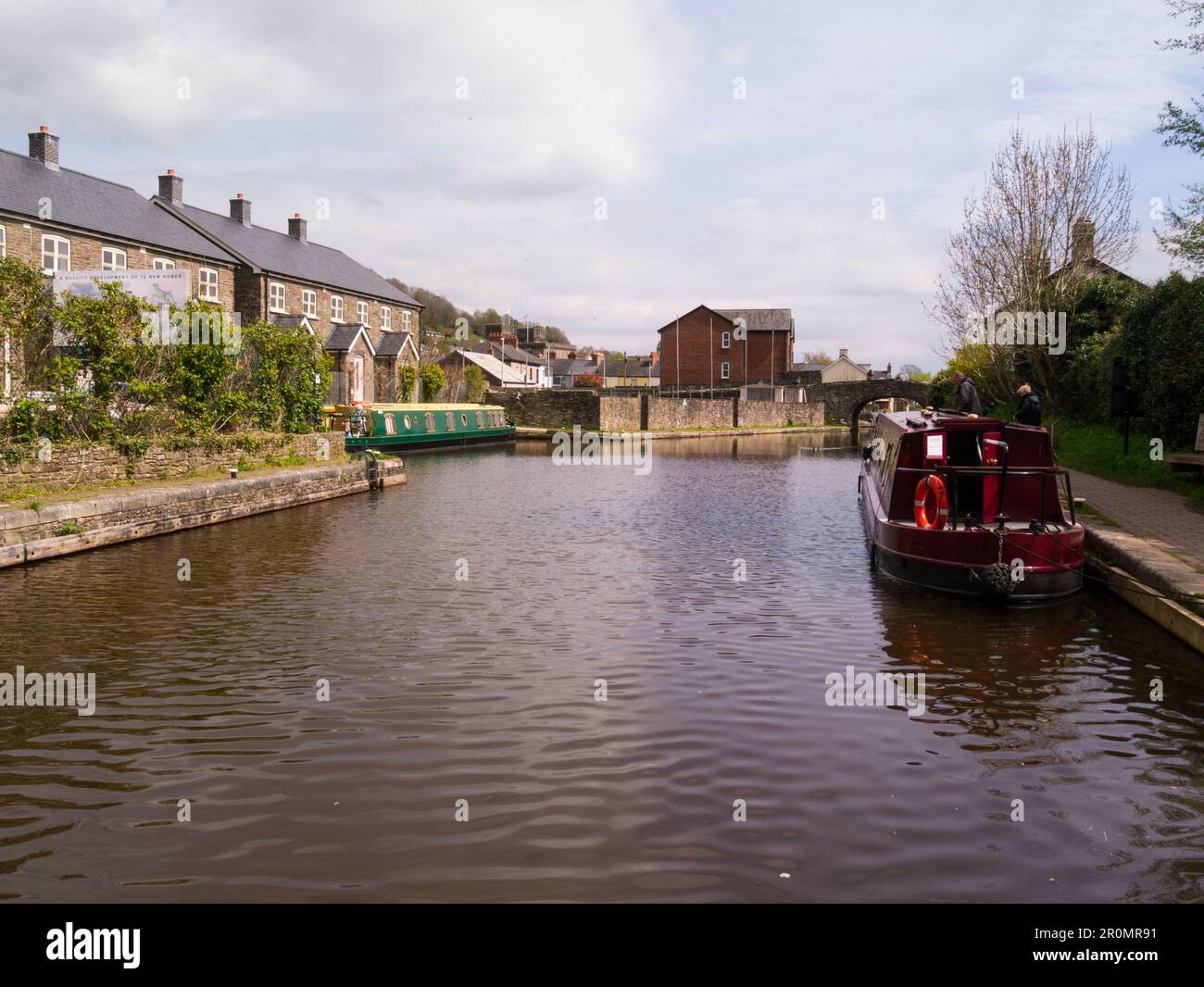 Red Narrowboat preparing to leave Brecon Basin Canal Wharf for journey ...