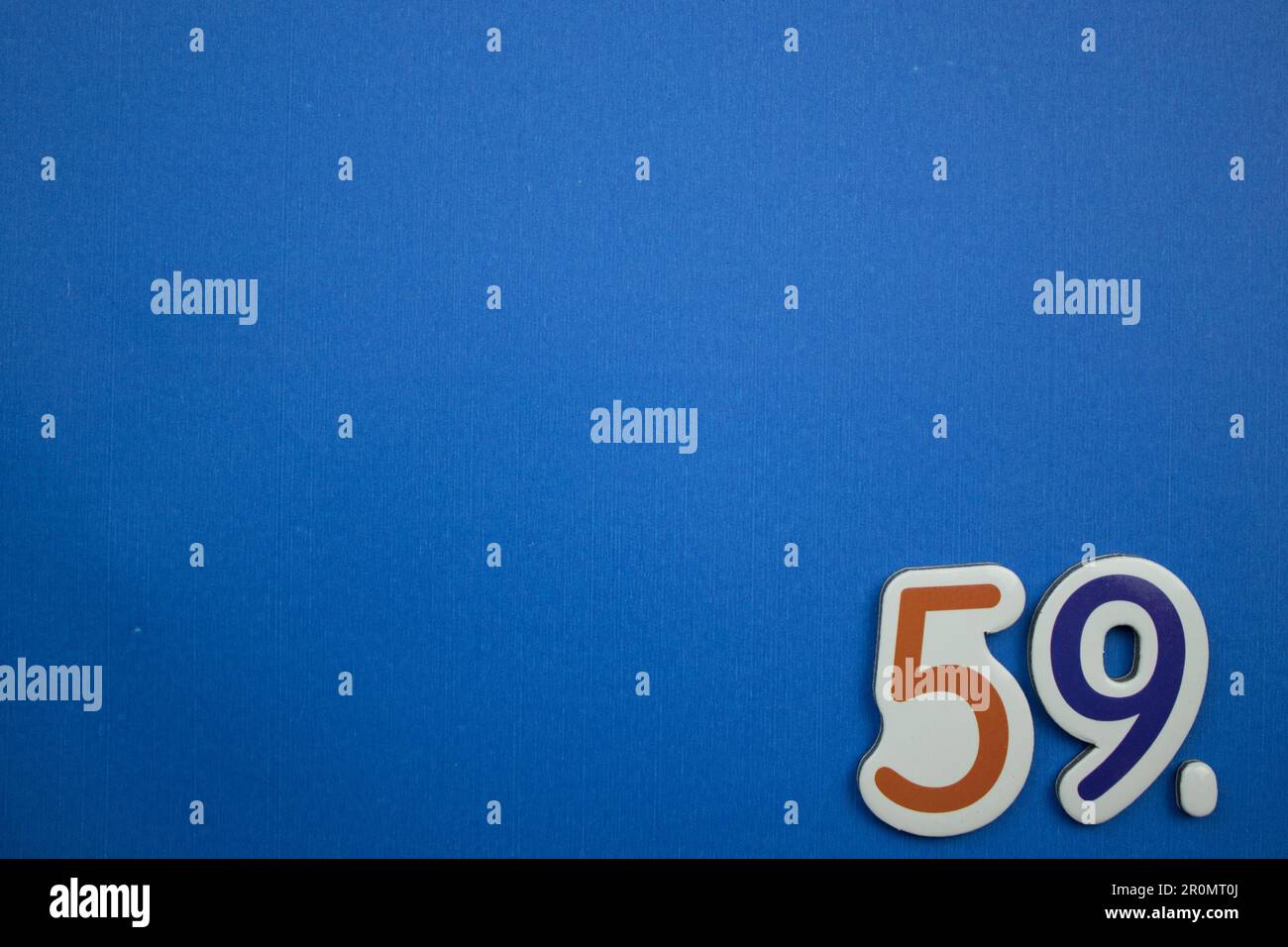 The number 59 in red and dark blue, photographed from above, placed on ...