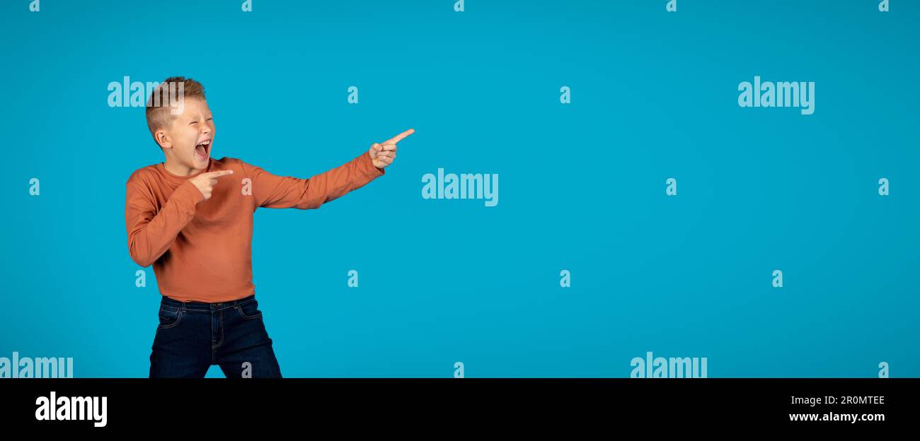 Lol. Laughing Preteen Boy Pointing Aside At Copy Space Stock Photo - Alamy