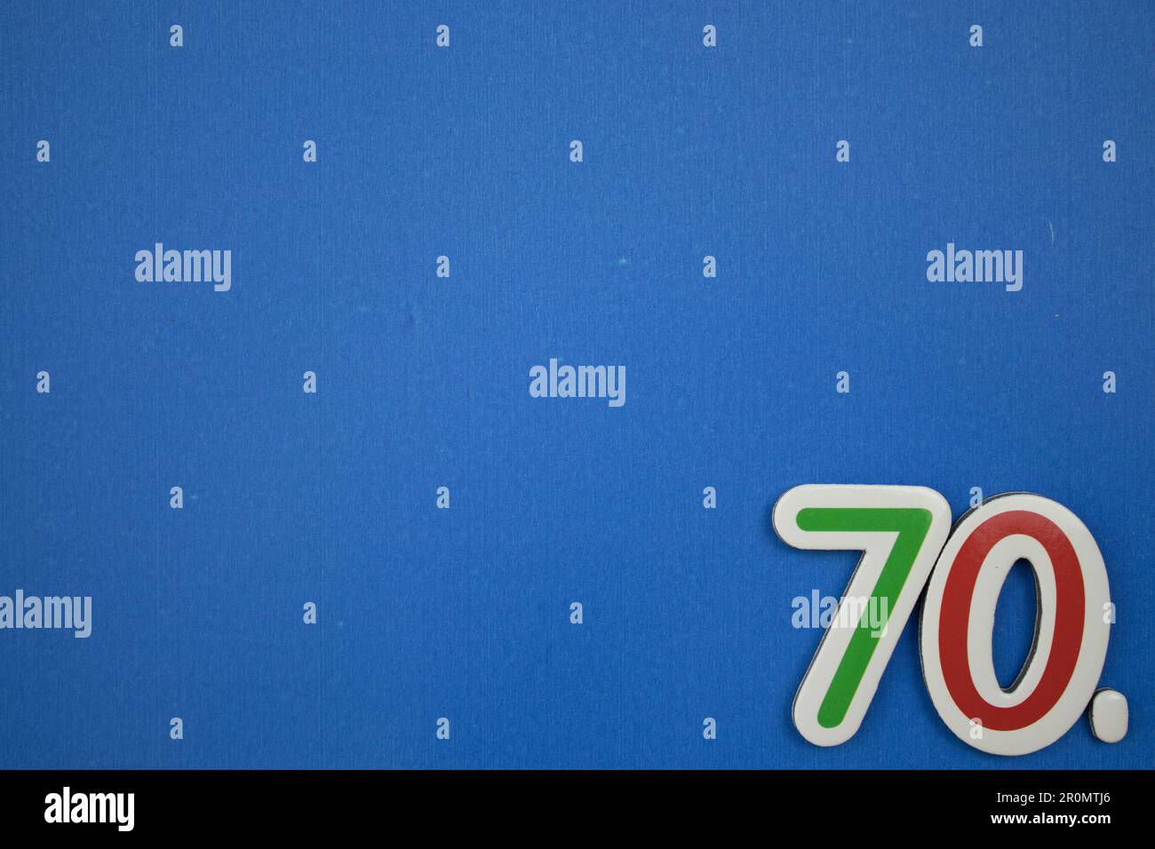 Number 70 in green and red, photographed from above, placed on the edge ...