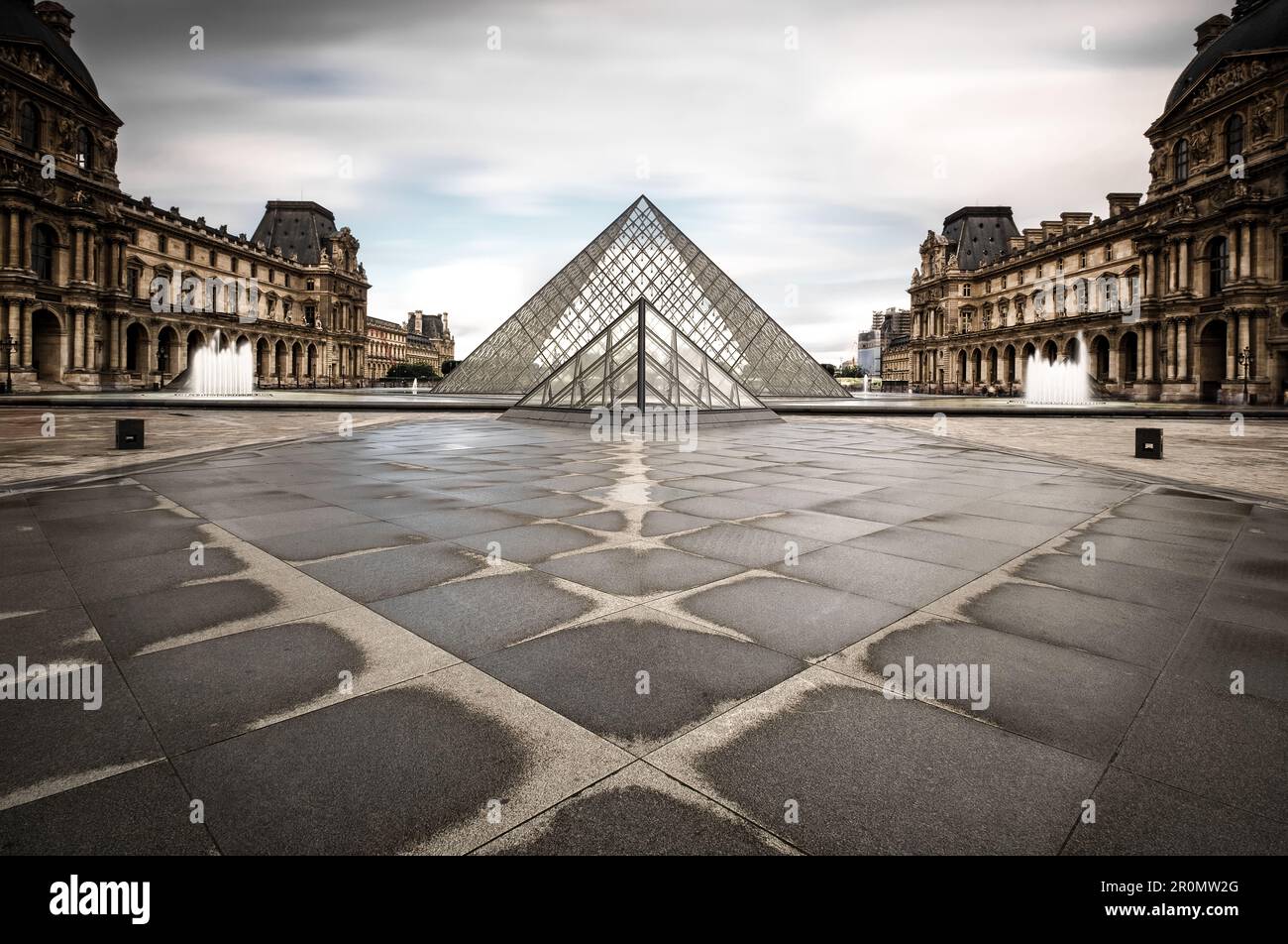 Courtyard of the Louvre with a view of the glass pyramid after the rain ...