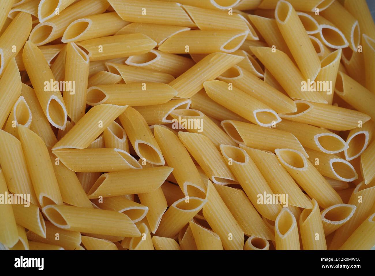 Penne Rigate Pasta, Penne is an extruded type of pasta with cylinder ...