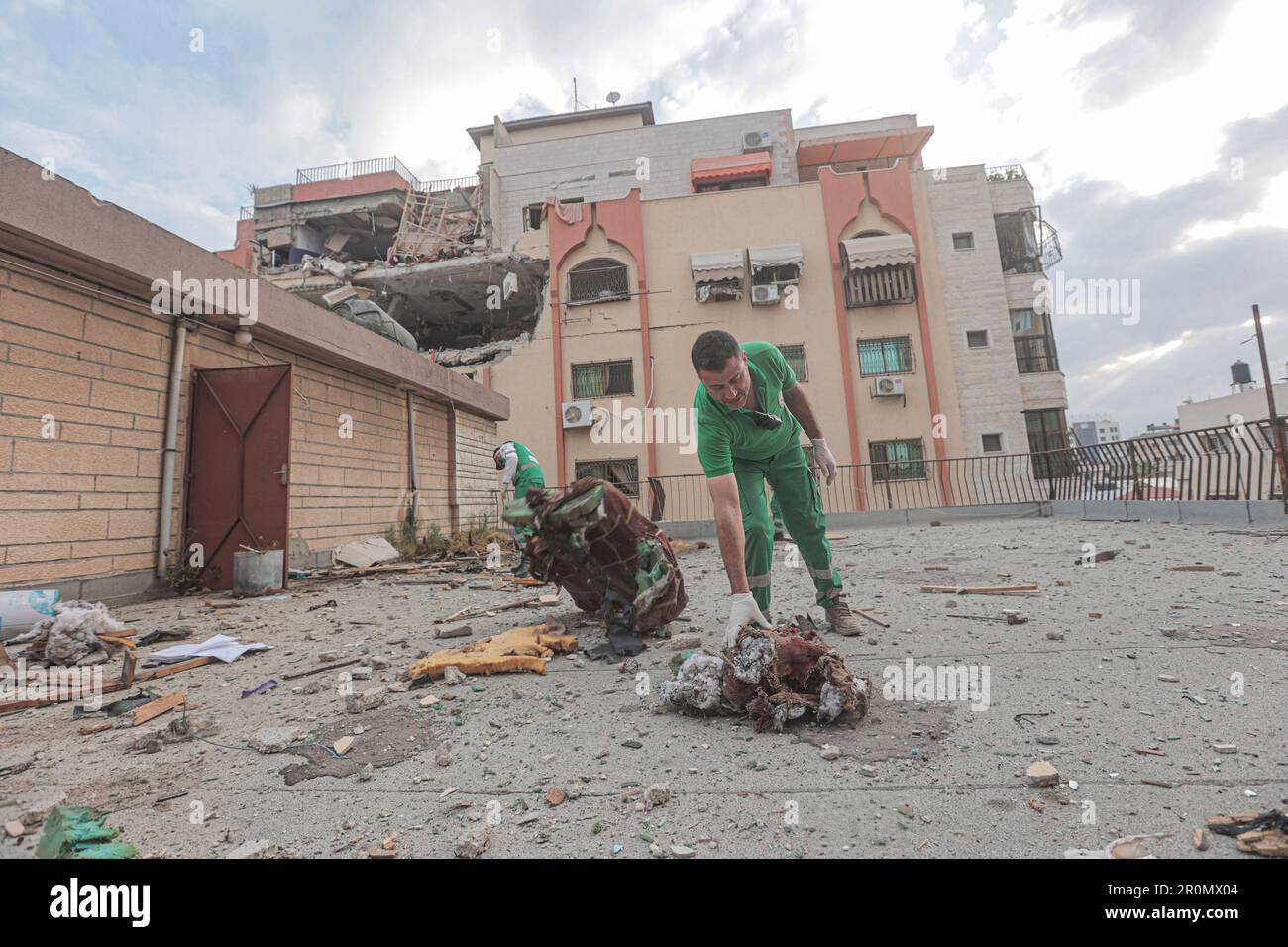 Gaza City. 09th May, 2023. Palestinian paramedics inspect damage in a ...