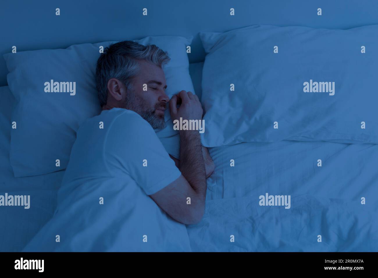 Man and sleeping alone and darkness hi-res stock photography and images ...