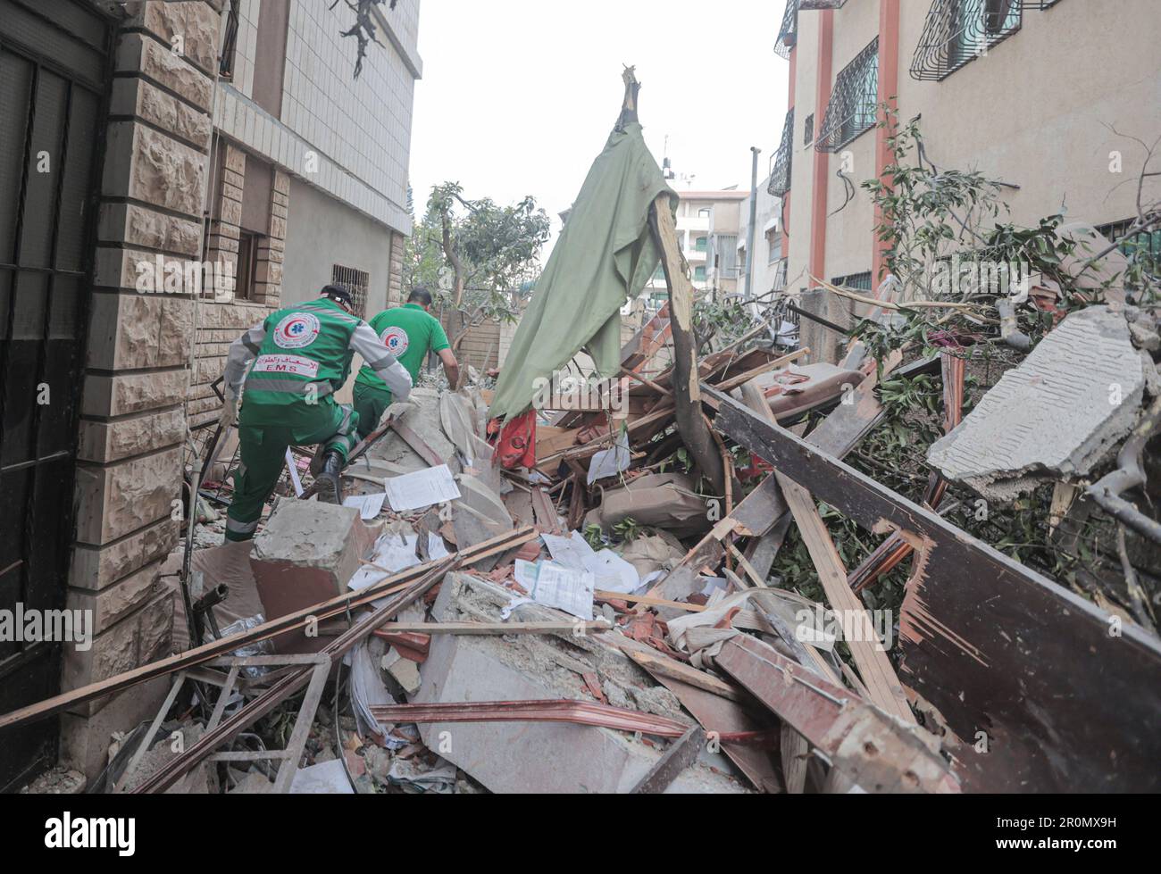 Palestinian paramedics inspect damage in a building following Israeli ...