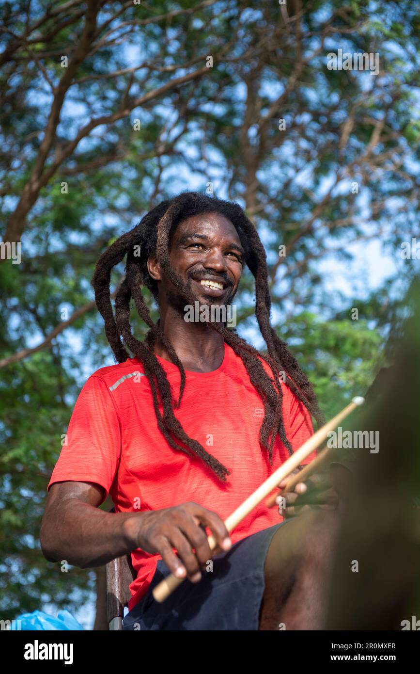 Cape Verde, Island Santiago, rasta man playing drums, music, smile ...