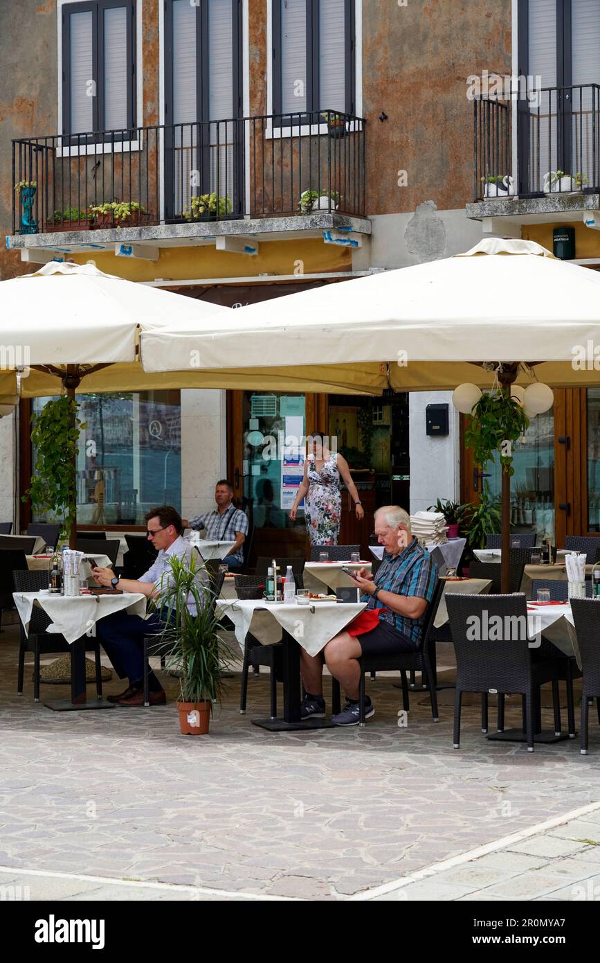 Traditional outdoor restaurant of the Giudecca, Venice, Veneto, Italy ...