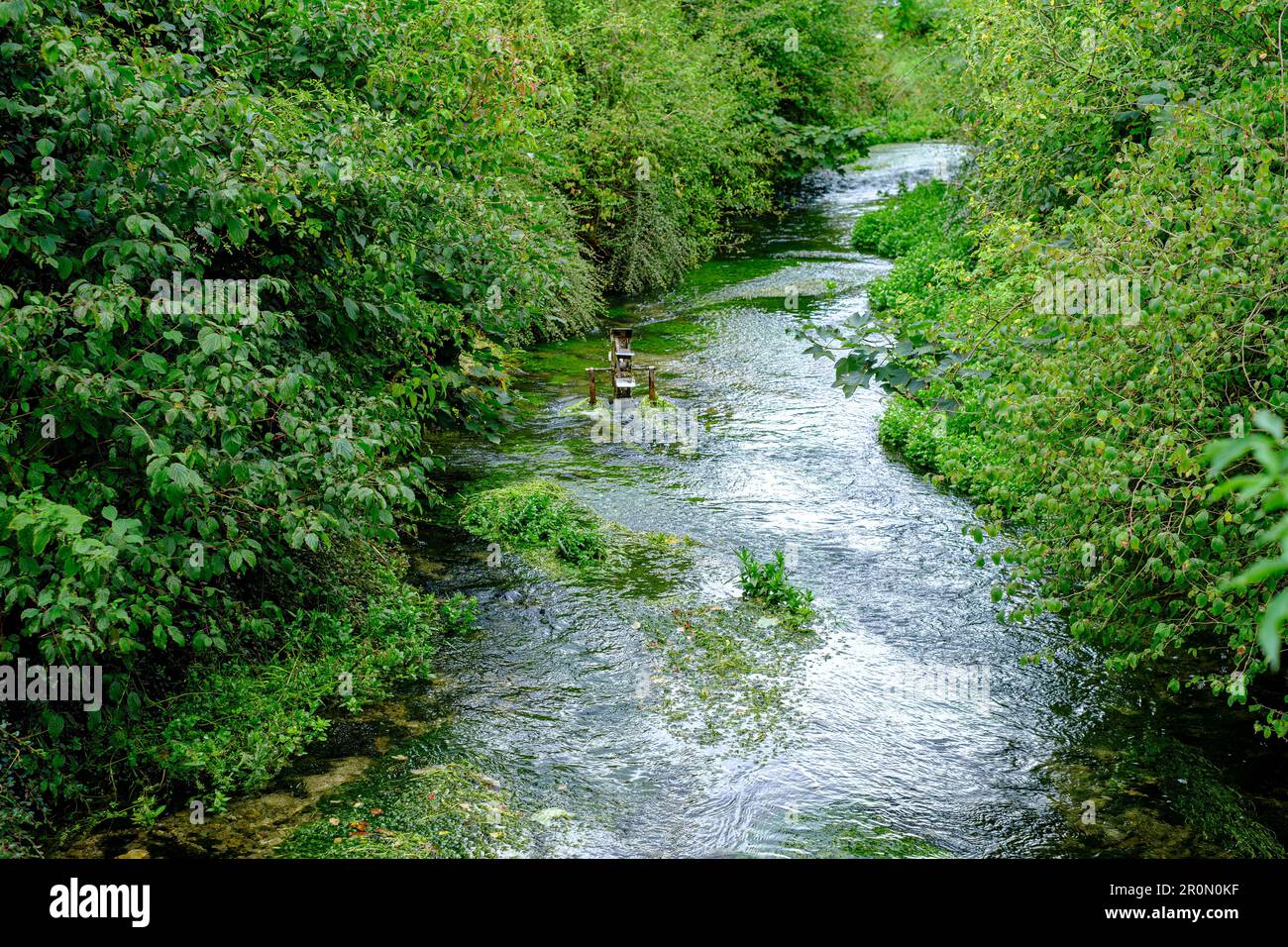 Small water wheel in a small stream Stock Photo - Alamy