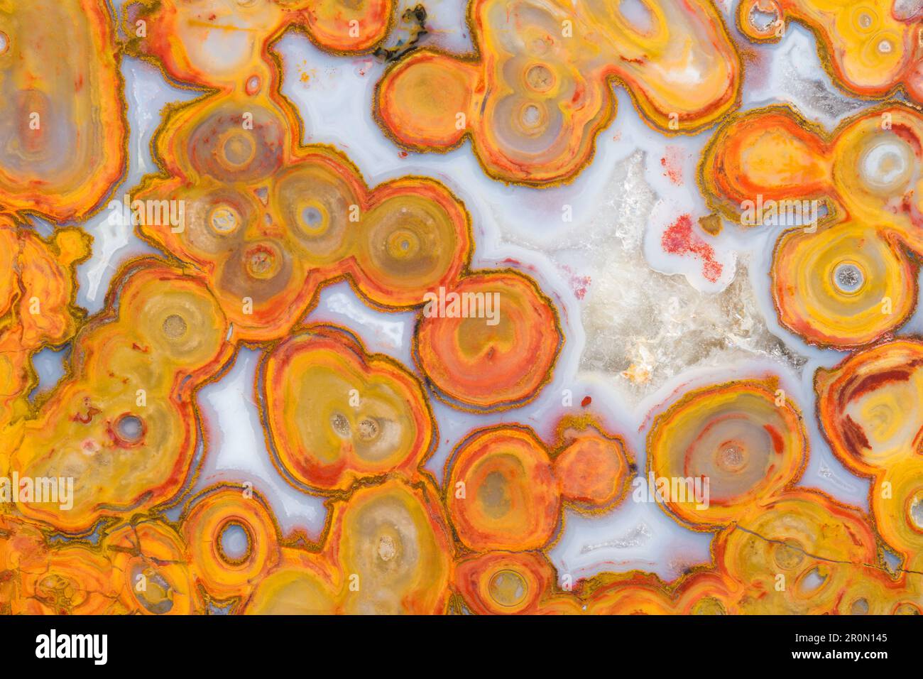 Closeup abstract background of bright orange colored onyx stone texture ...