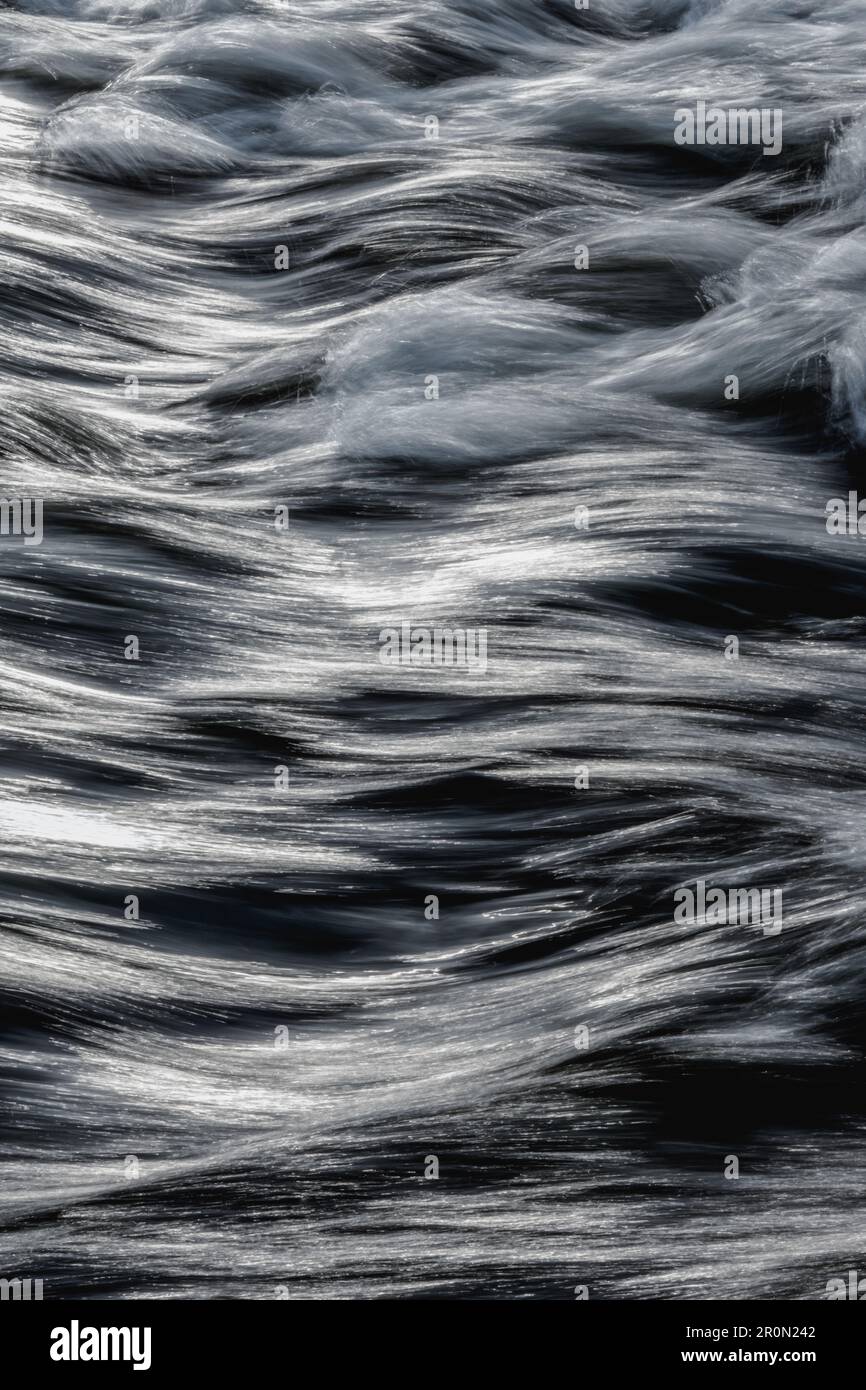 Smooth flow of fast rushing water Stock Photo - Alamy