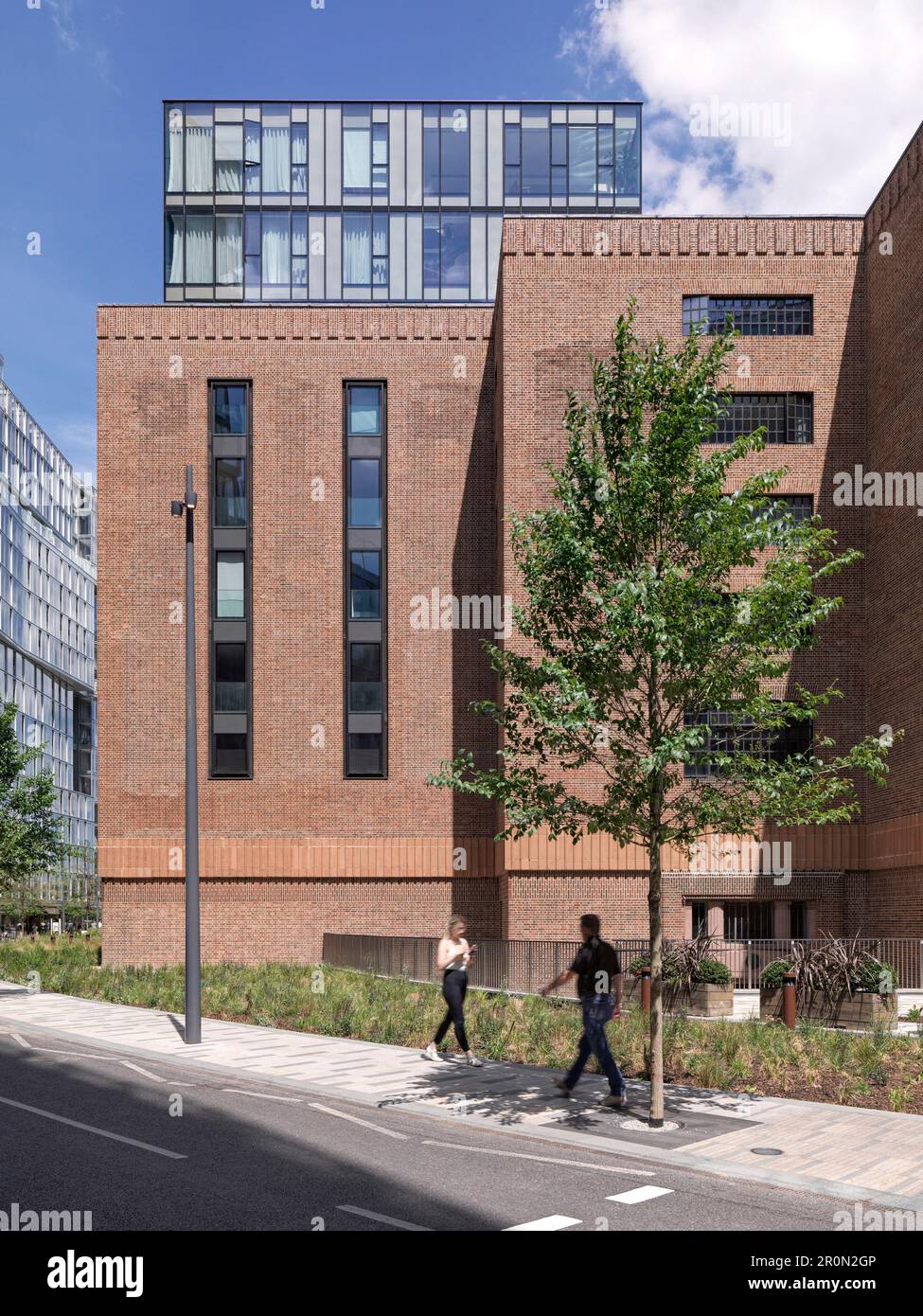 Walkways and refurbished brick facade of BPS. Public Realm at Battersea ...