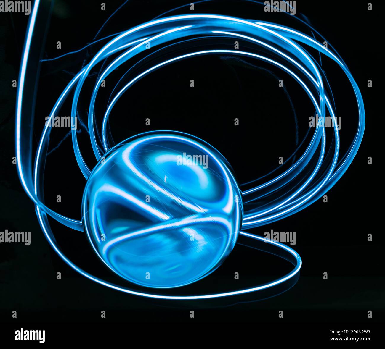 Neon ball wrapped in light tubes Stock Photo - Alamy