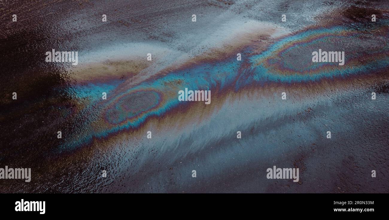 Oil slicks on wet asphalt Stock Photo - Alamy