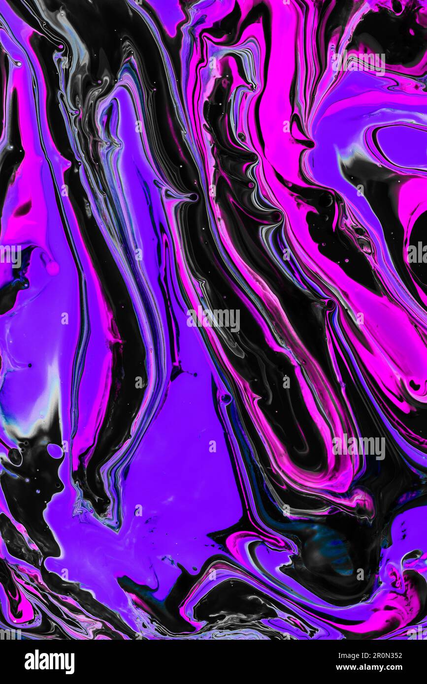 Close-up shot of thick paint of various bright colors flowing down and ...