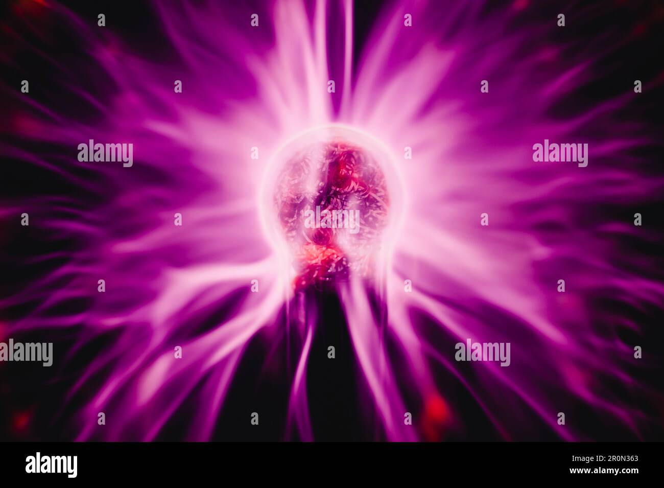 Abstract neuron shaped neon light pattern created by glowing plasma ...