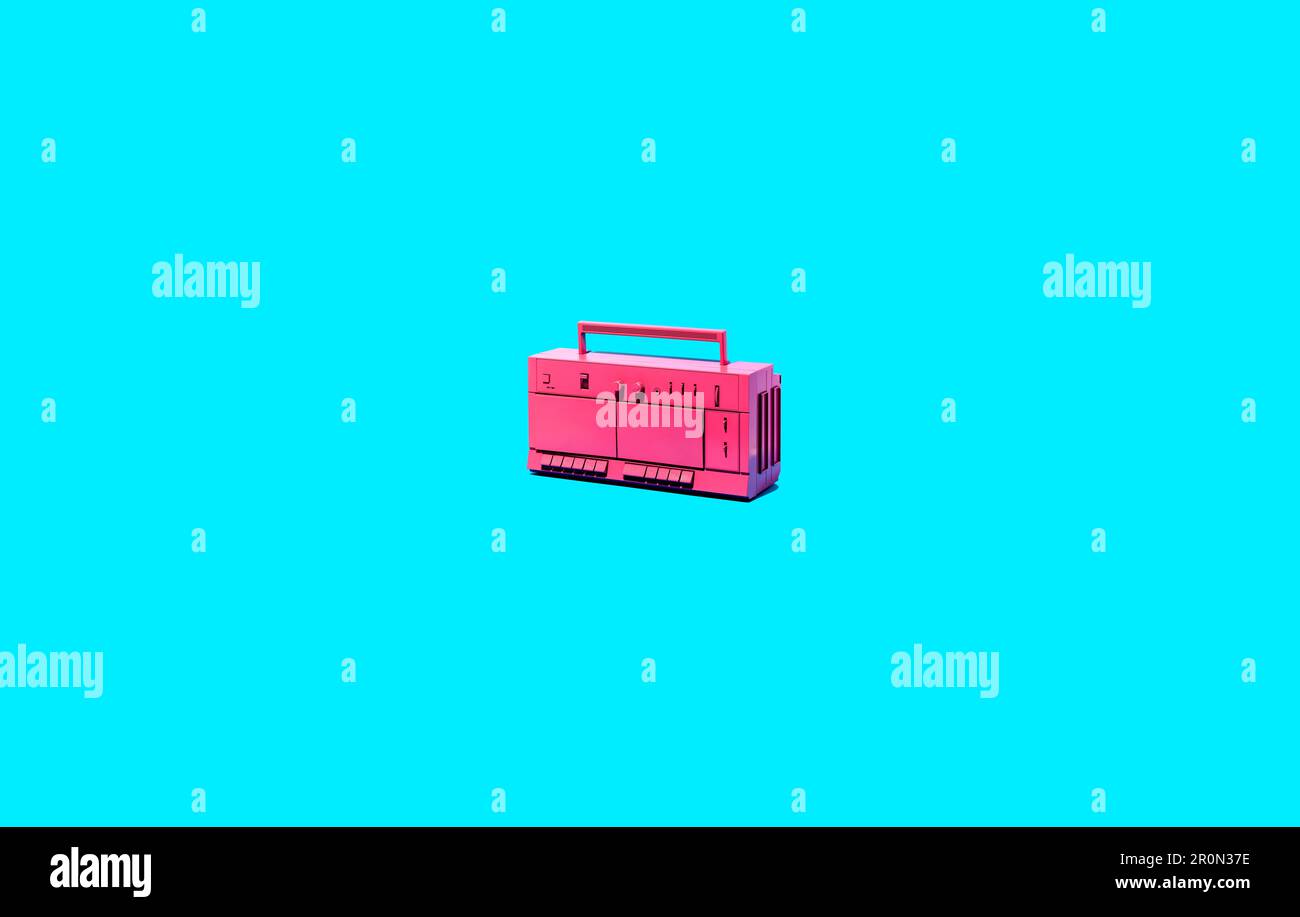 of bright pink retro cassette tape recorder seen from a distance placed ...
