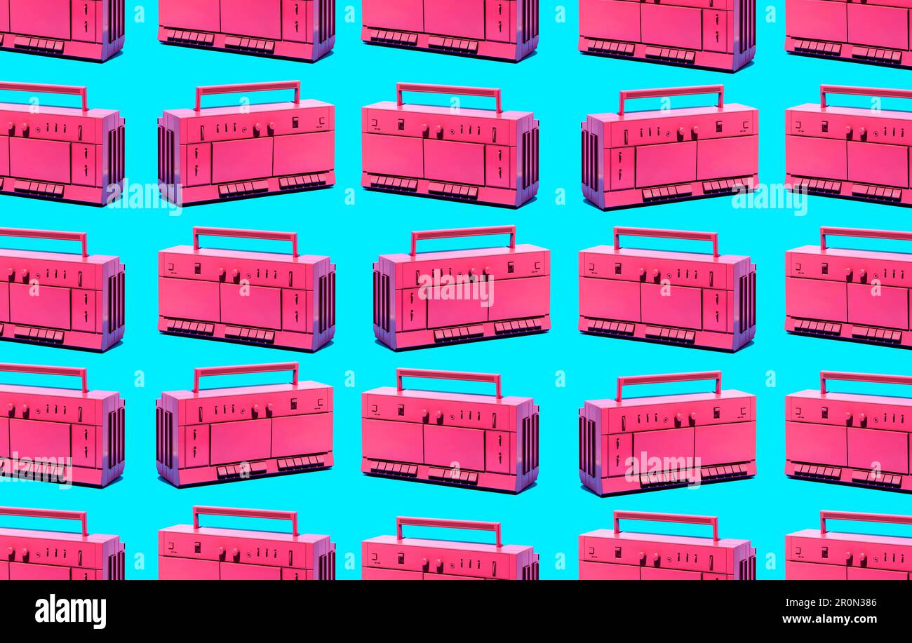 Pattern of set of similar pink retro tape recorder against blue ...
