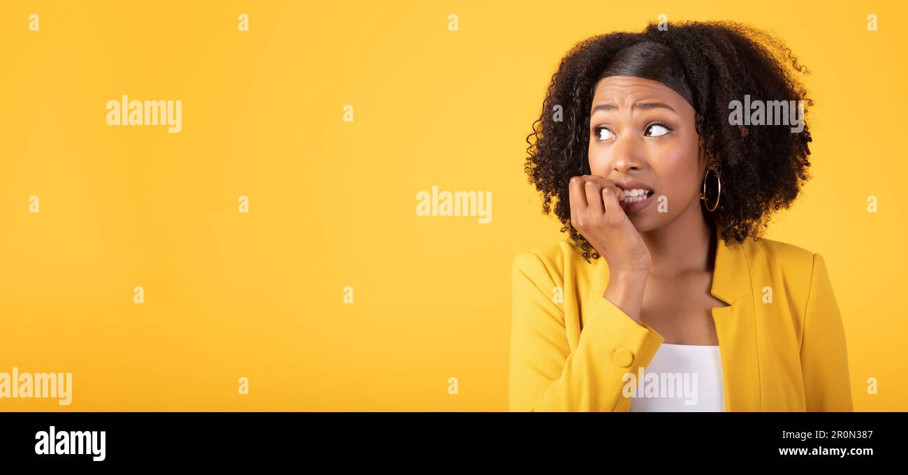 Scared terrifying black lady with bushy hair gesturing and grimacing ...