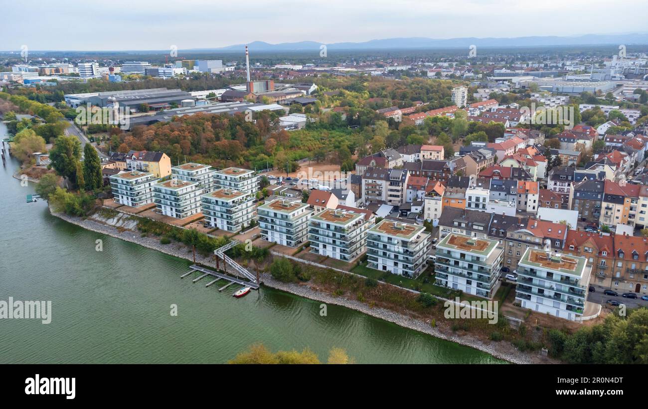 An aerial view of cityscape Mannheim surrounded by buildings and water ...