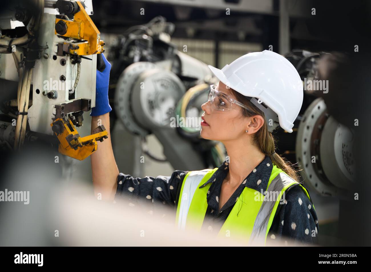 Factory worker managing industrial machine hi-res stock photography and ...
