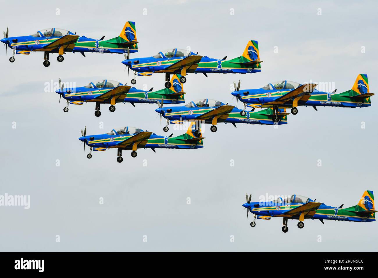 Spectacular airplanes soar through a bright blue sky, moving swiftly ...