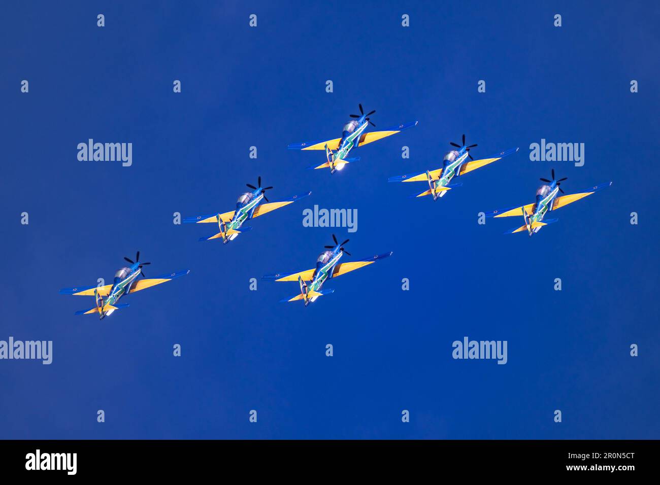 Spectacular airplanes soar through a bright blue sky, moving swiftly ...