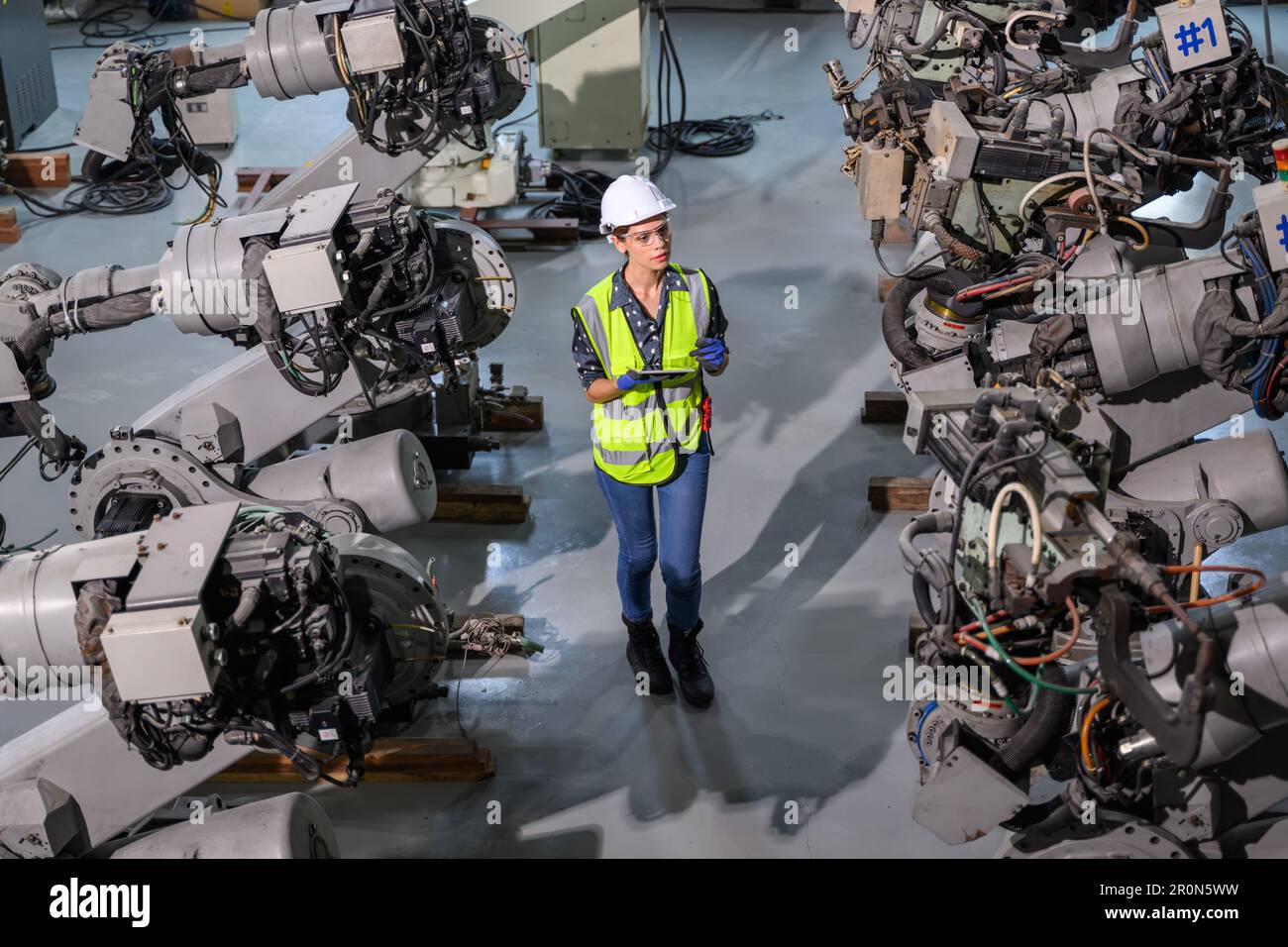 Factory worker managing industrial machine hi-res stock photography and ...