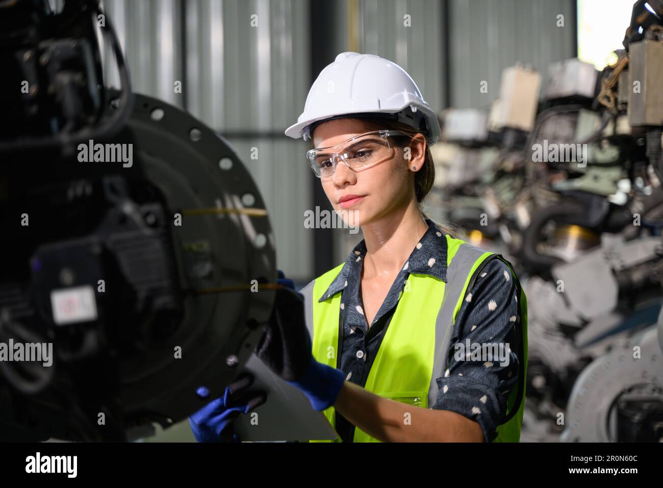 Factory worker managing industrial machine hi-res stock photography and ...