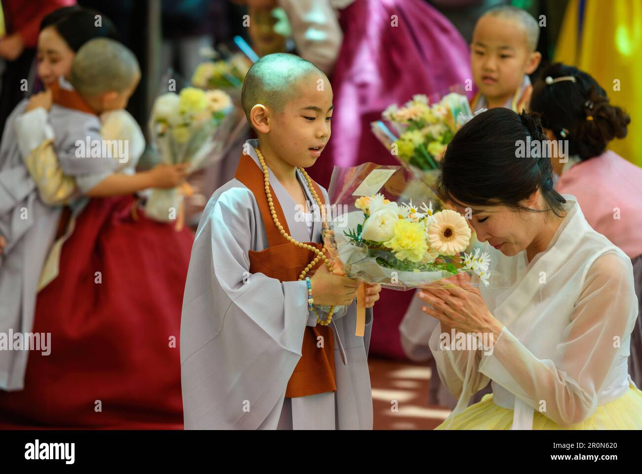 A South Korean child monk seen with his mother during an event to ...
