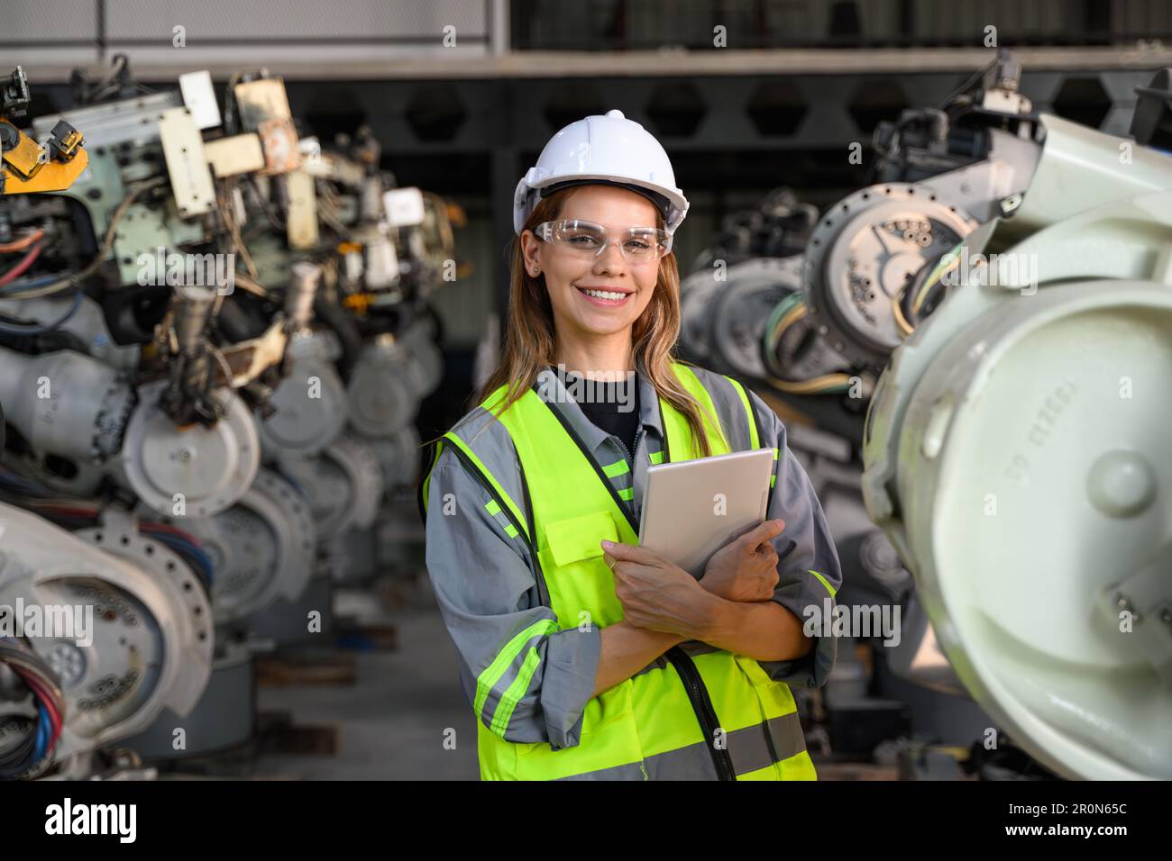 Maintenance engineer worker working with robotic machine automation ...