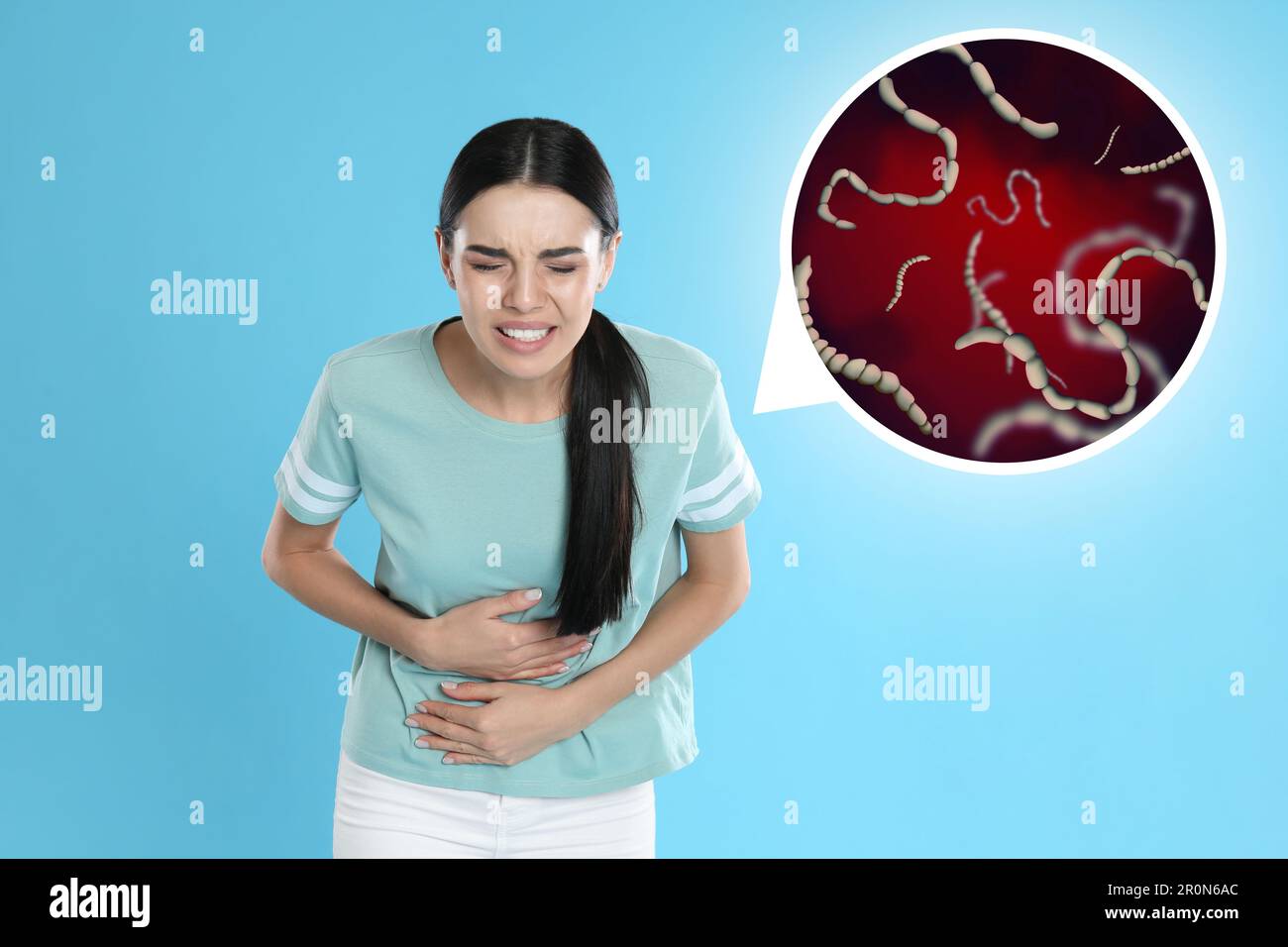 Parasites under microscope and woman suffering from helminthiasis Stock ...